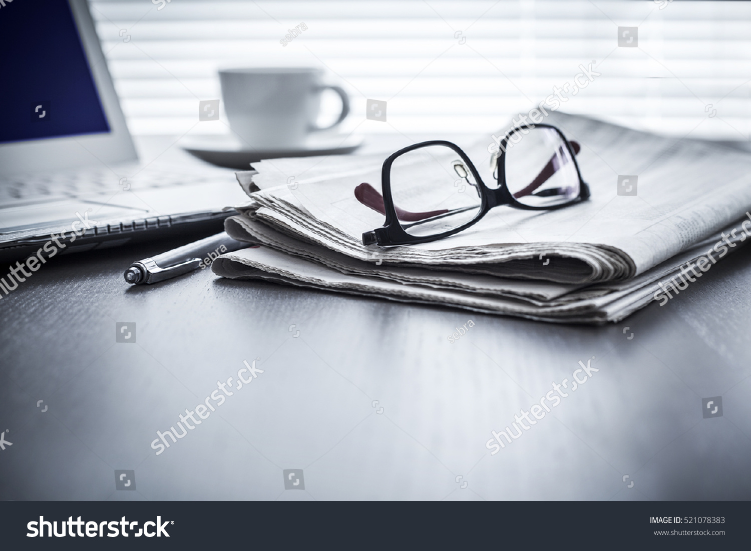 stock-photo-newspaper-with-computer-on-table-521078383 | Washington ...